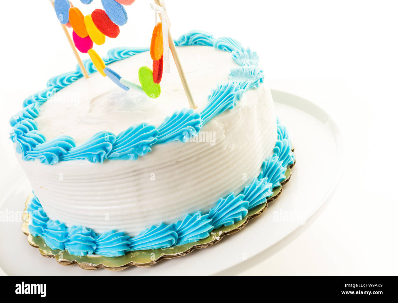 Simple white Birthday cake with cake garland Stock Photo - Alamy