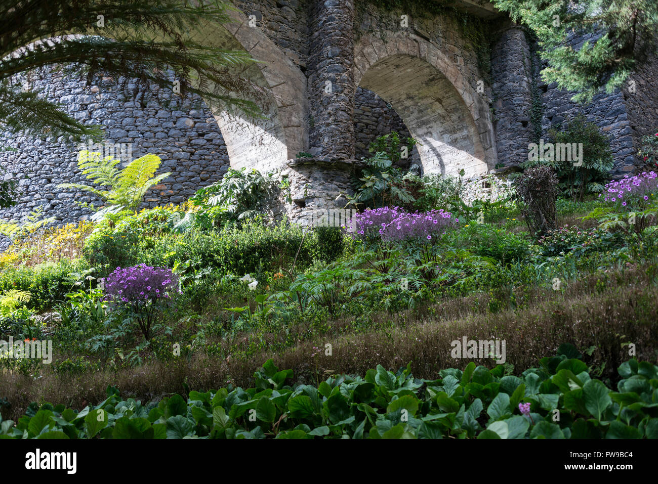 flower garden in Monte Madeira with old bridge Stock Photo - Alamy