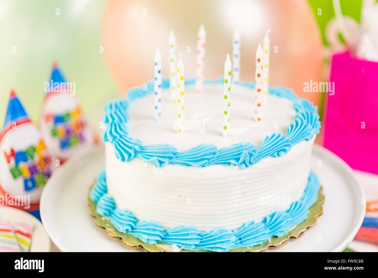 Simple white Birthday cake with cake candles Stock Photo - Alamy