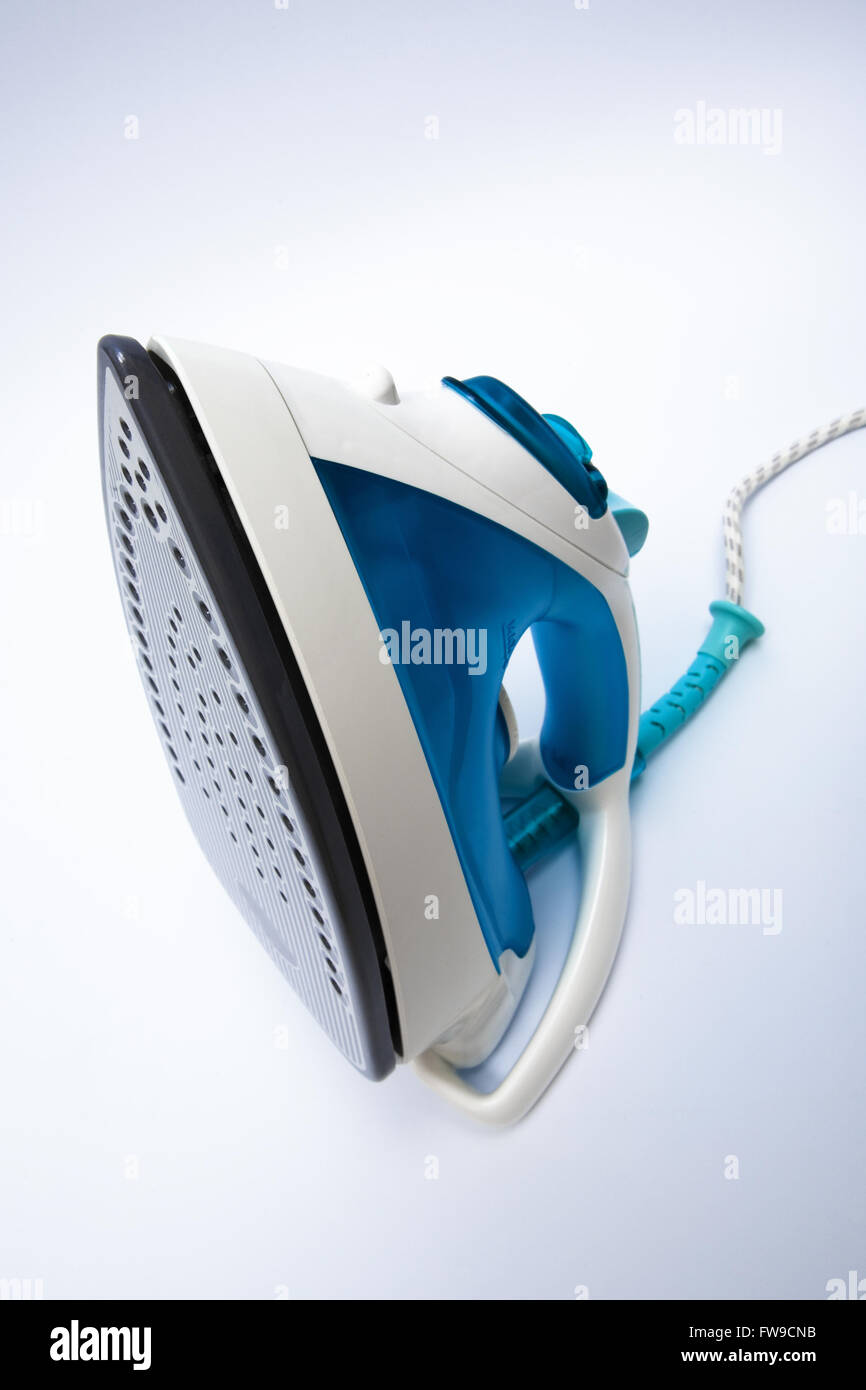 New and modern iron with a teflon covering Stock Photo - Alamy