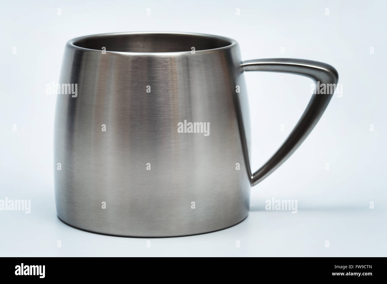 Elegant and modern metal mug for coffee Stock Photo - Alamy