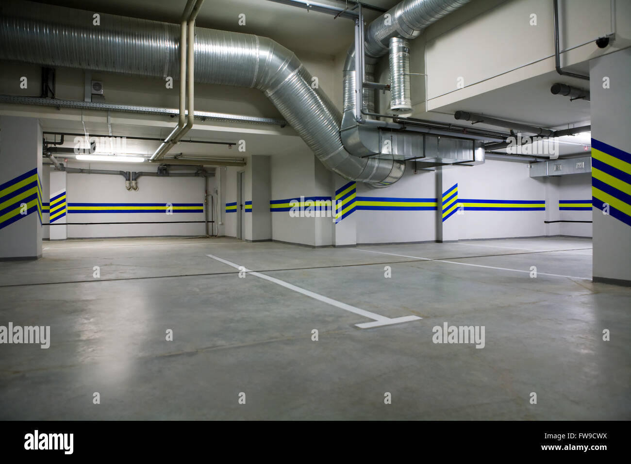 Parking in a cellar of a modern building Stock Photo - Alamy