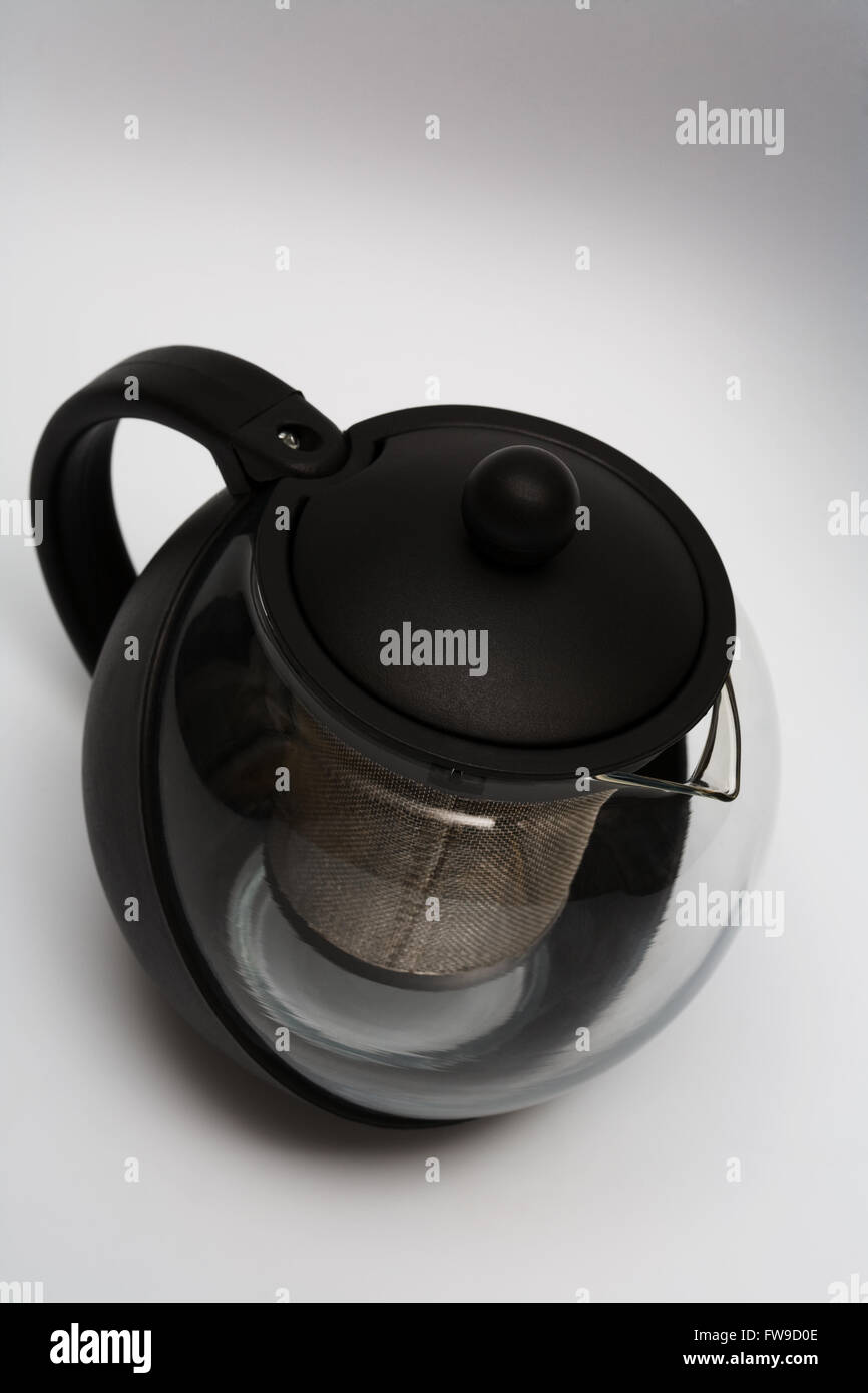 Modern glass teapot for preparation of tea Stock Photo - Alamy