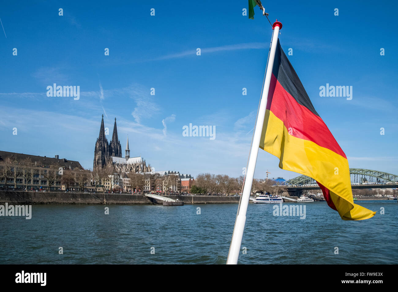 Cologne, River Rhine scene with the German Flag and Cologne Cathedral ...