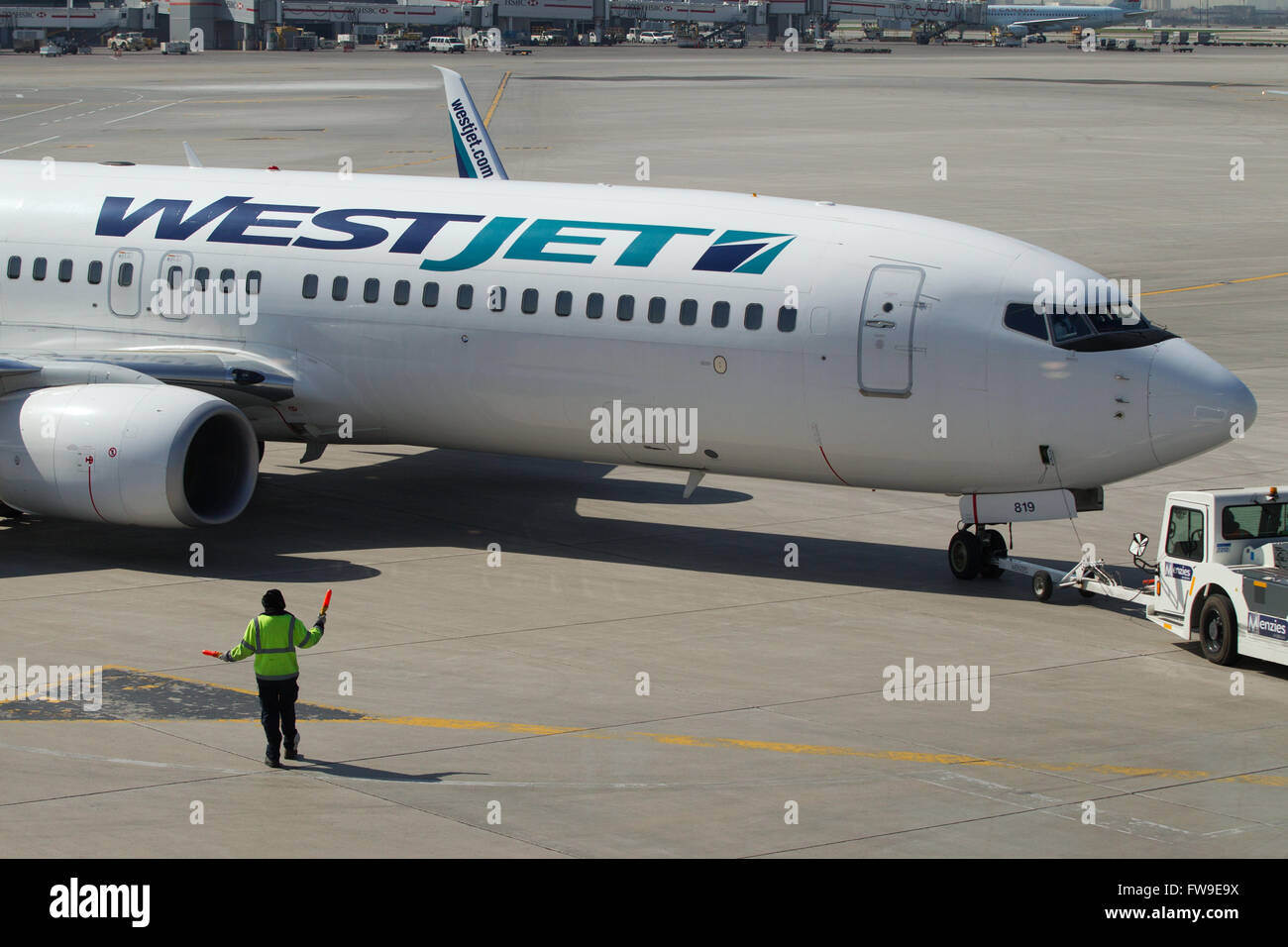 A Westjet aircraft waits to be loaded before departing from Pearson ...