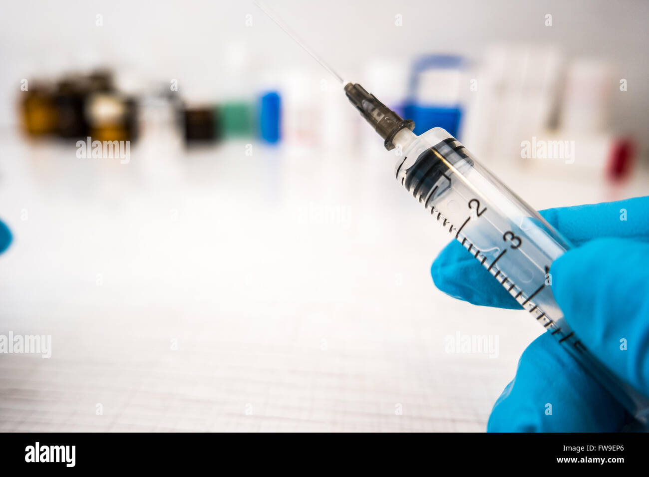 Doctor's hands in blue robber gloves Stock Photo - Alamy