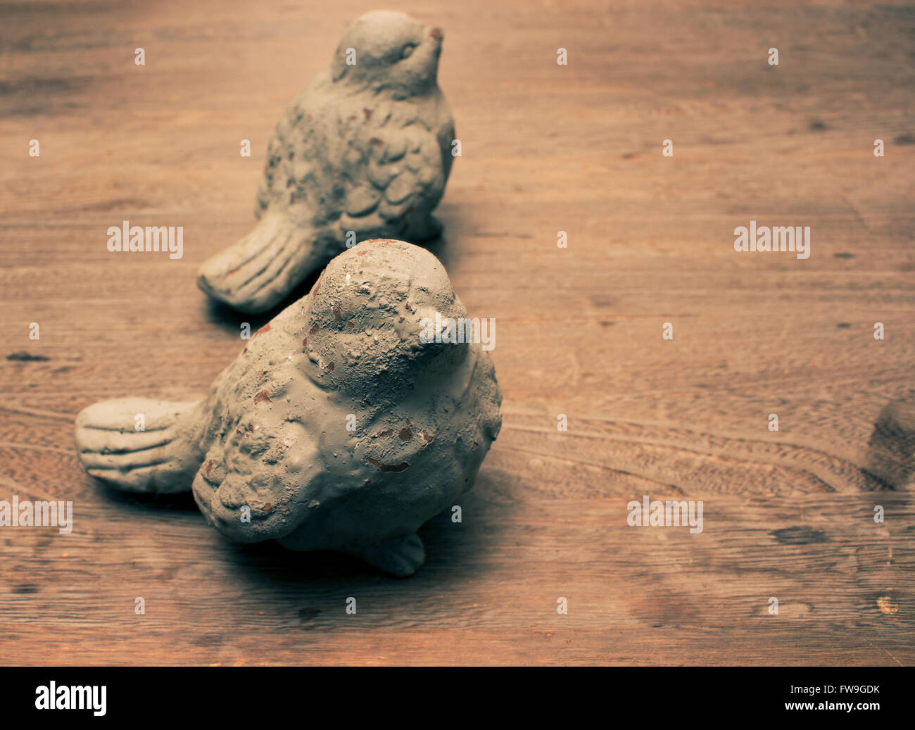 Bird decoration objects on wood table Stock Photo - Alamy