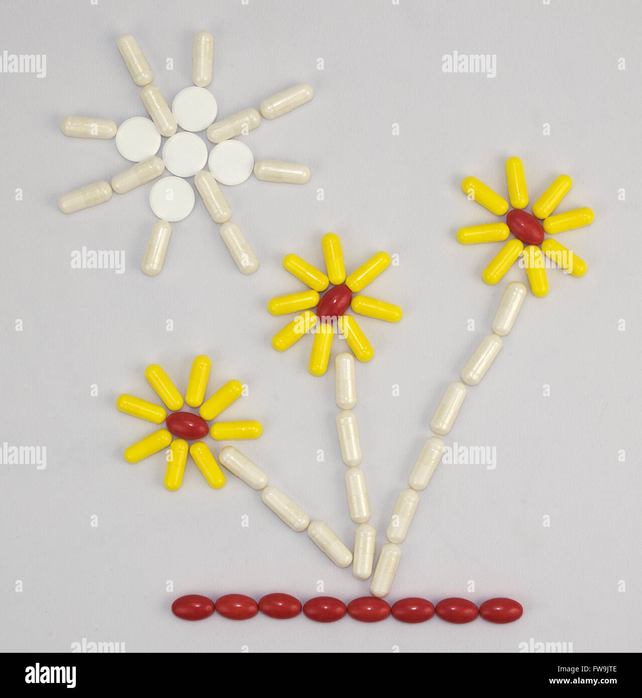 Flat picture of pills and capsules on a grey background Stock Photo - Alamy