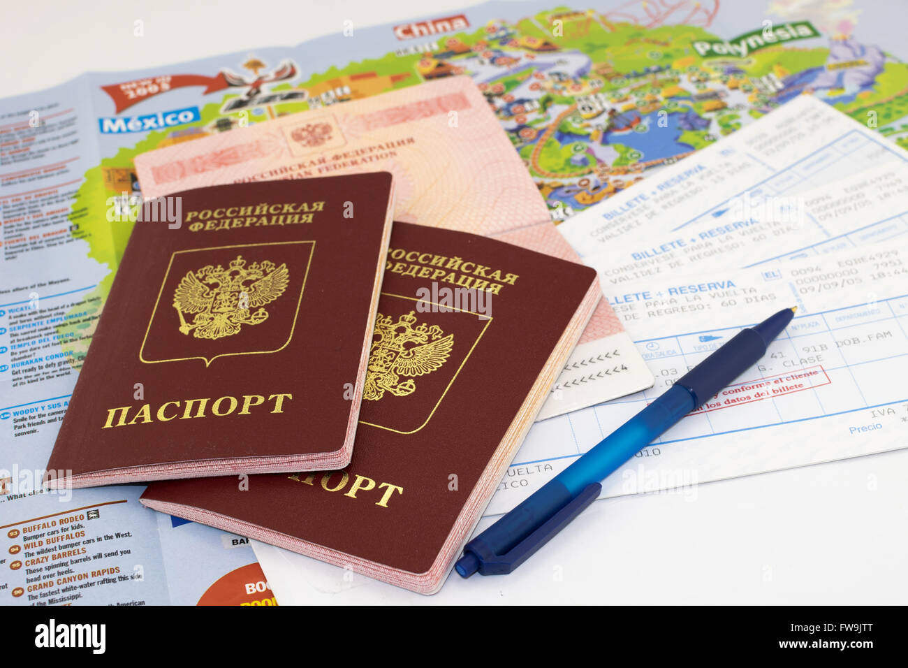 Three russian passports, railway tickets with a pen on the background ...