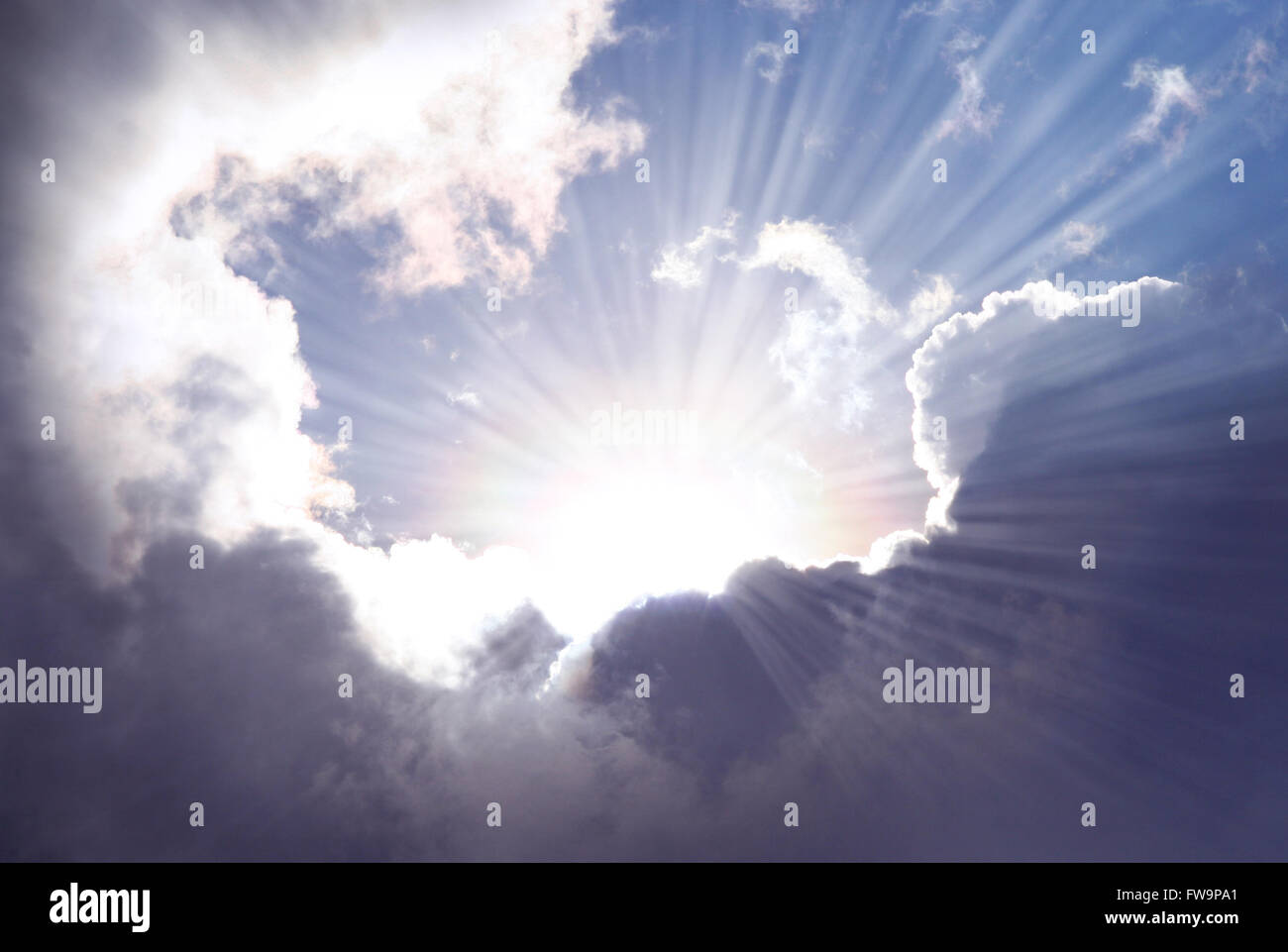 Sky opens up and light shines though dramatic clouds. Concept for hope ...
