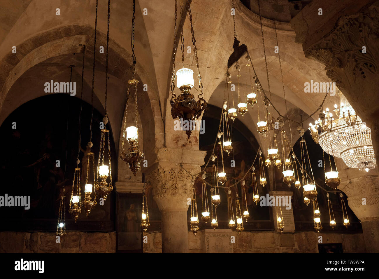 Sanctuary lamps hang at the Chapel of St. Helena which is dedicated to ...