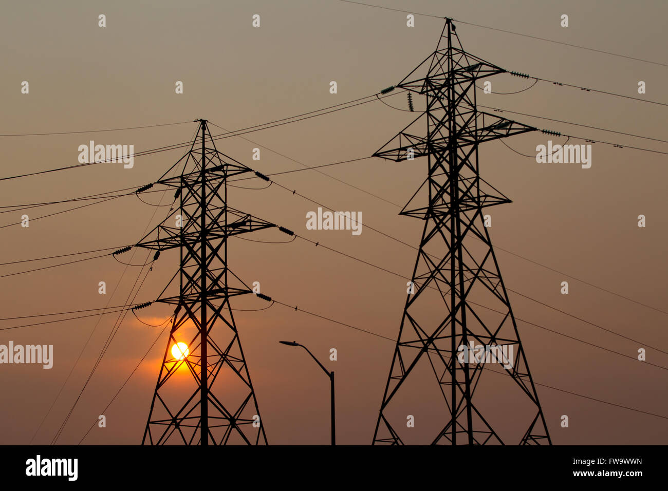 Hydro One power lines during sunset in Kingston, Ont., on Monday July 6 ...