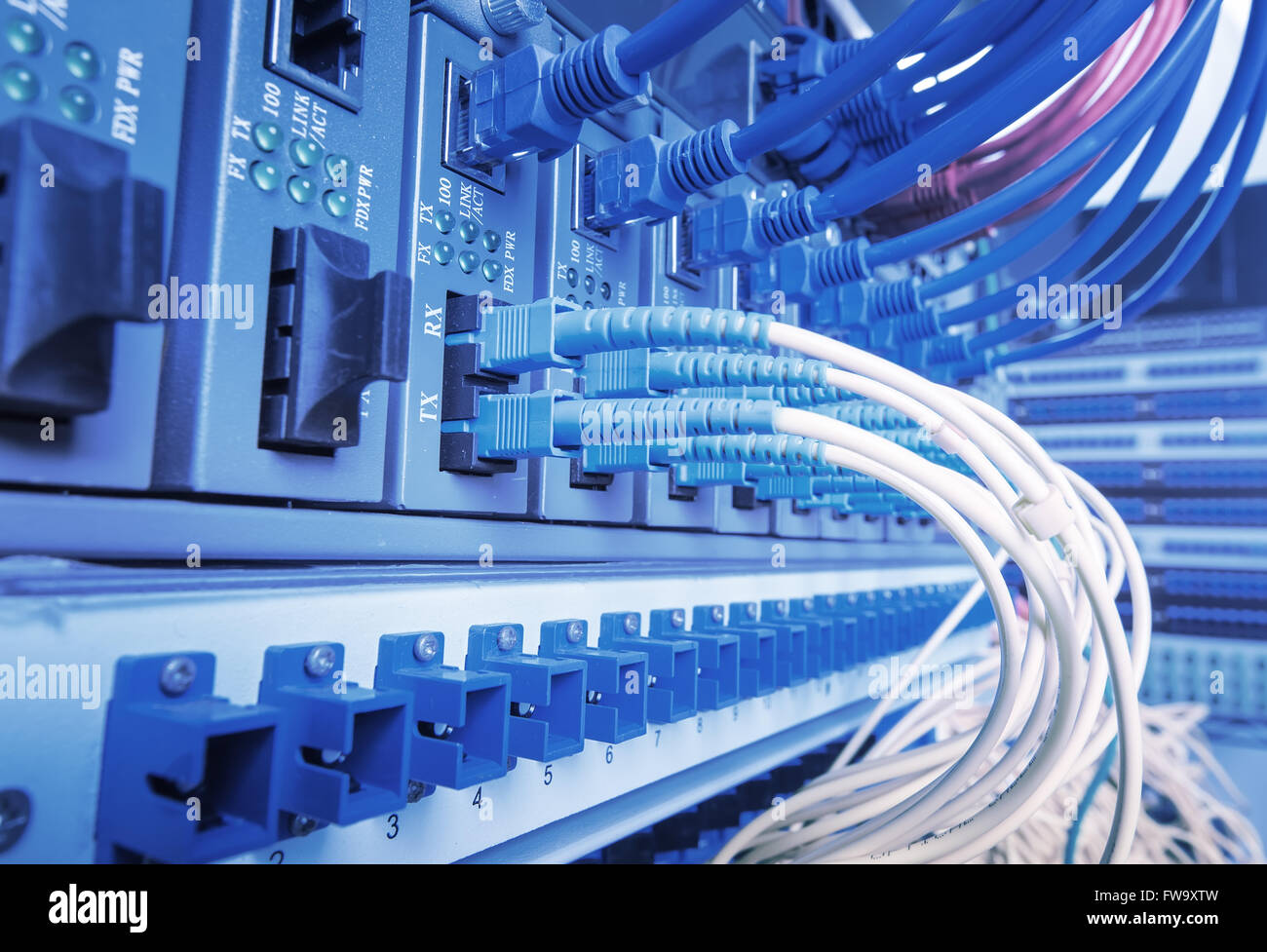 Fiber optic connecting on core network swtich Stock Photo - Alamy