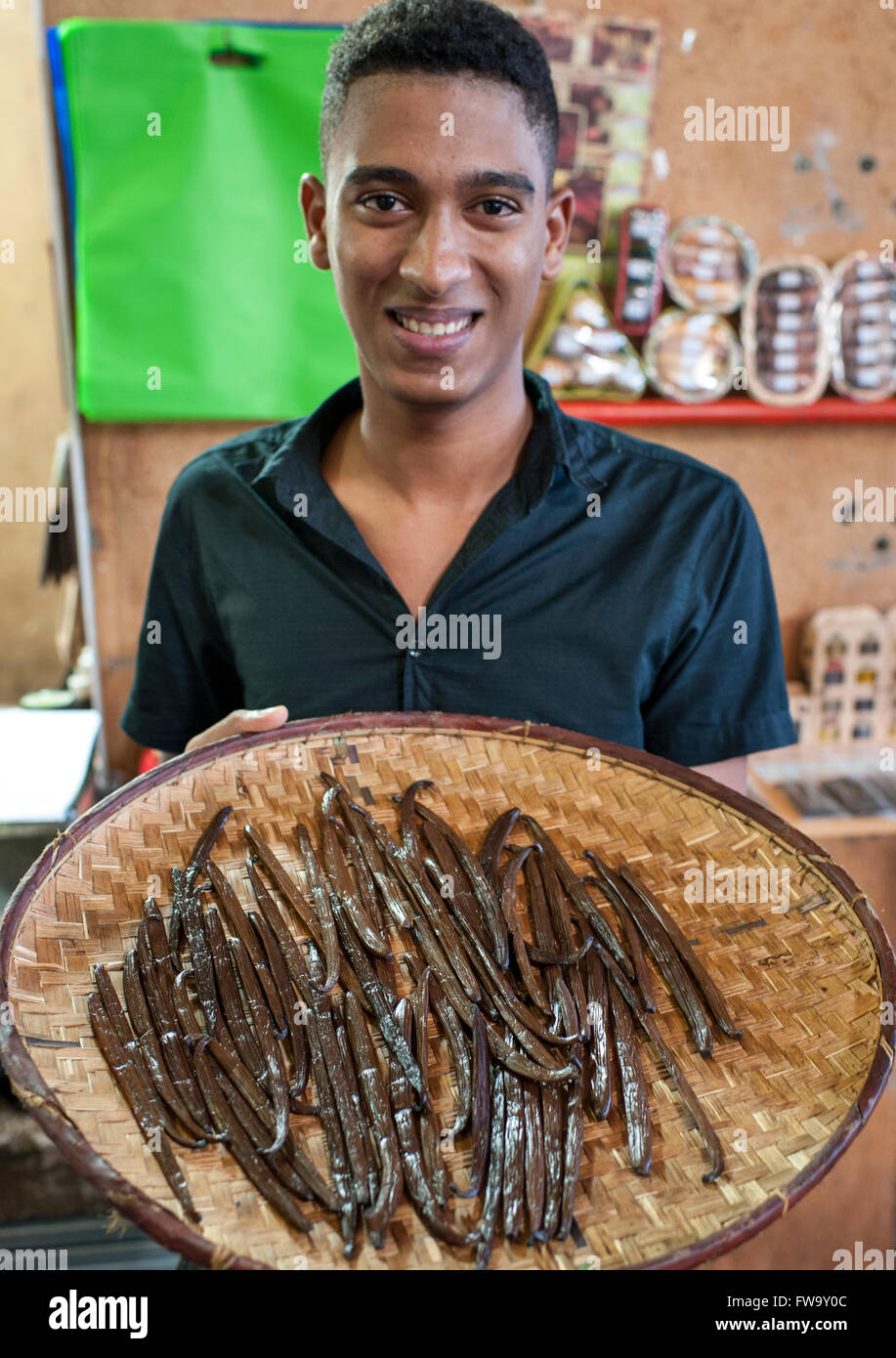 Man selling vanilla pods at the market in Port Louis, the capital of ...