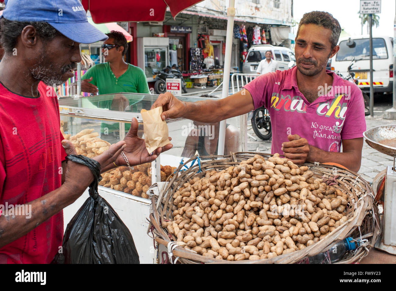Peanut vendor at the Port Louis street market in Mauritius Stock Photo ...