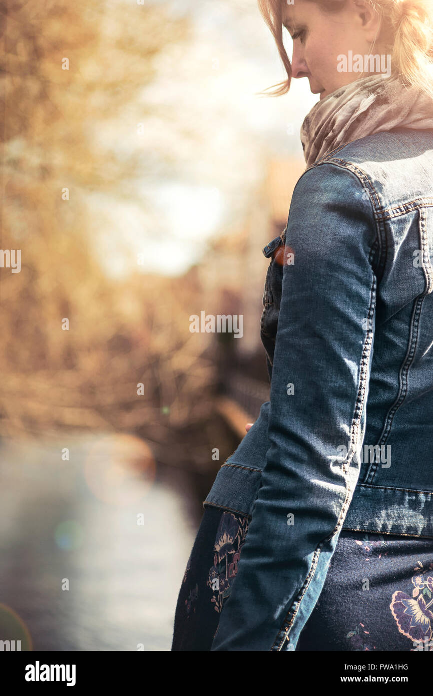 back view of the young female walking along the path Stock Photo - Alamy