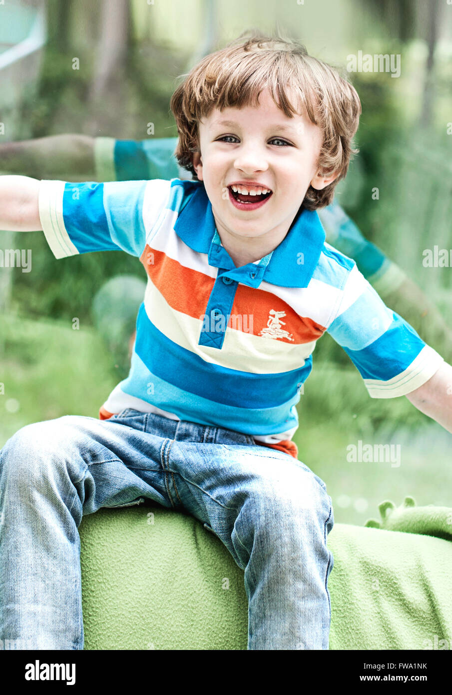 a small happy boy playing by the window in house Stock Photo - Alamy