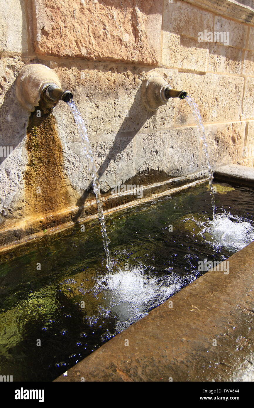 ancient water fountain water pipes Stock Photo - Alamy