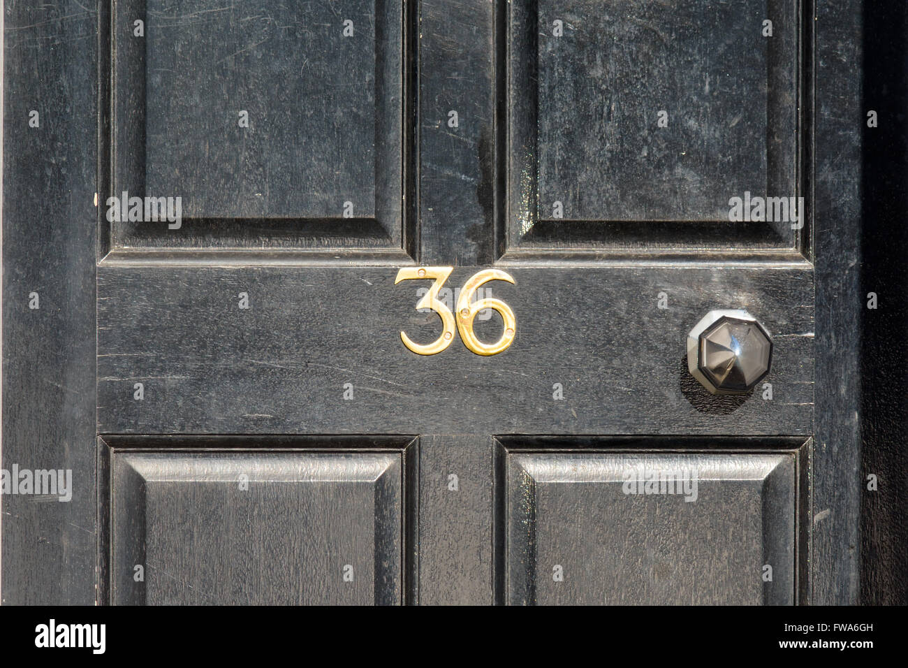 House number 36 sign on wooden door Stock Photo - Alamy