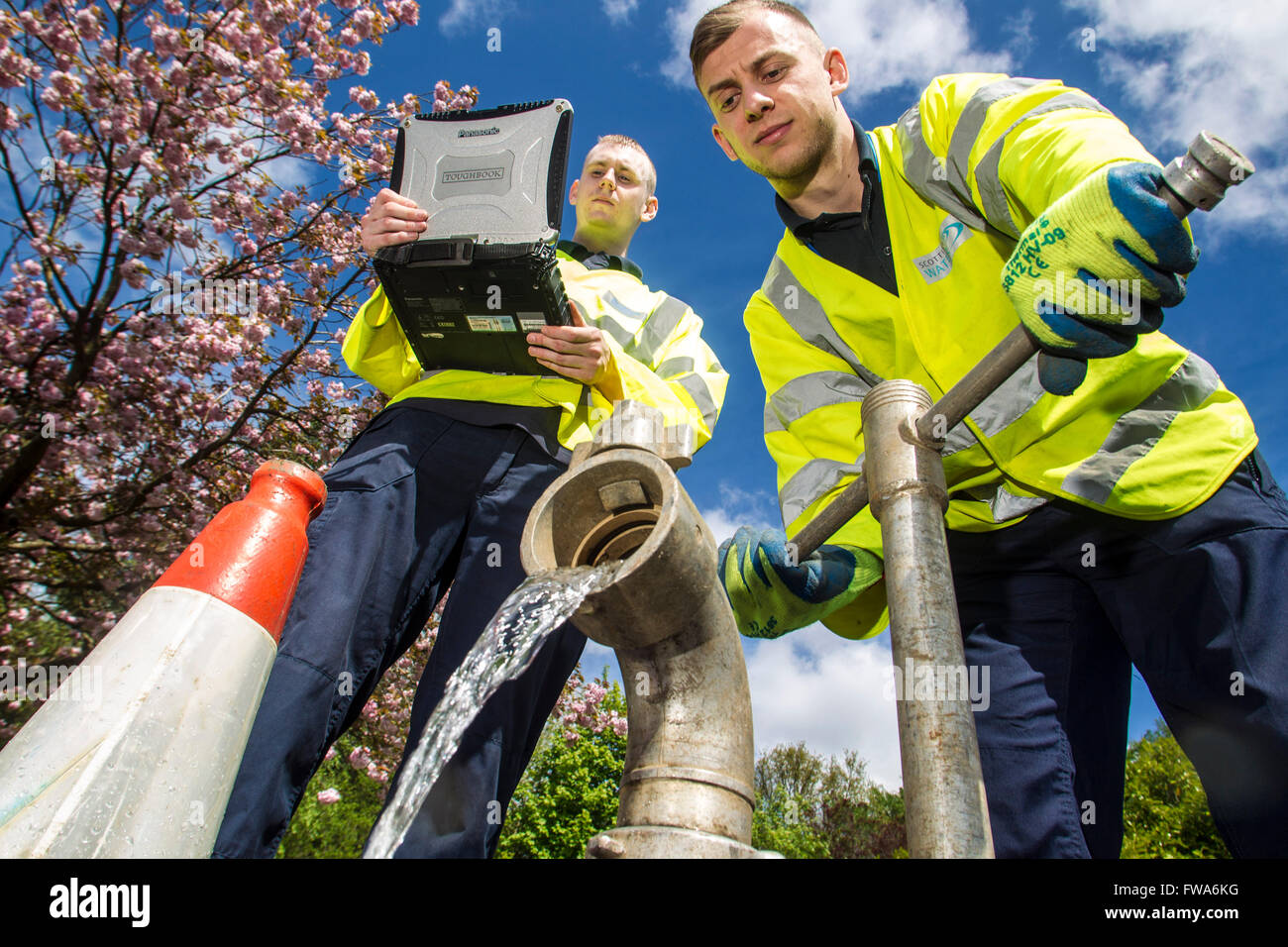 Water workers checking water pressure Stock Photo - Alamy