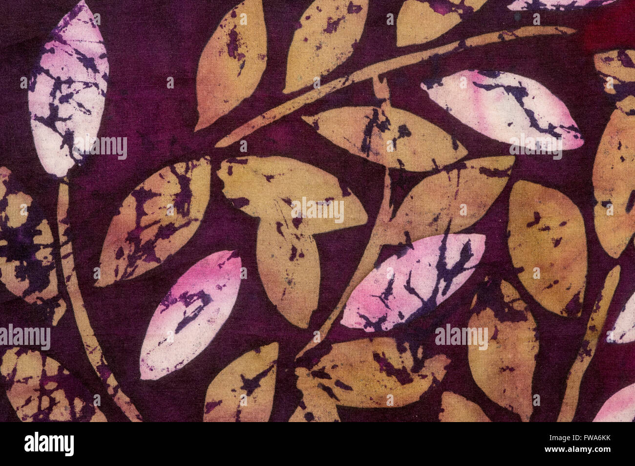 Tree branches with leaves on crimson background, hot batik, background ...