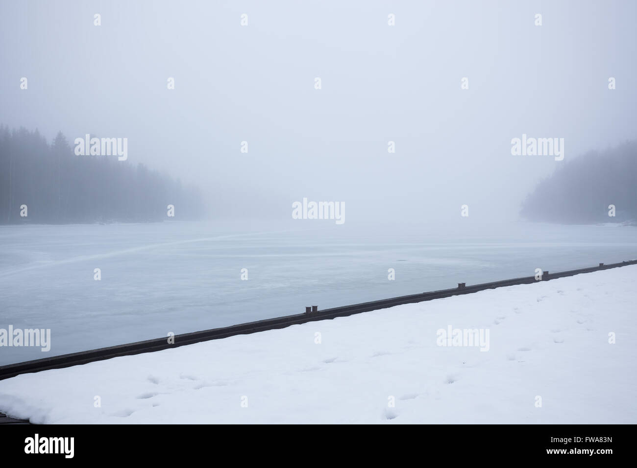 Thick fog at frozen lake landscape Stock Photo - Alamy