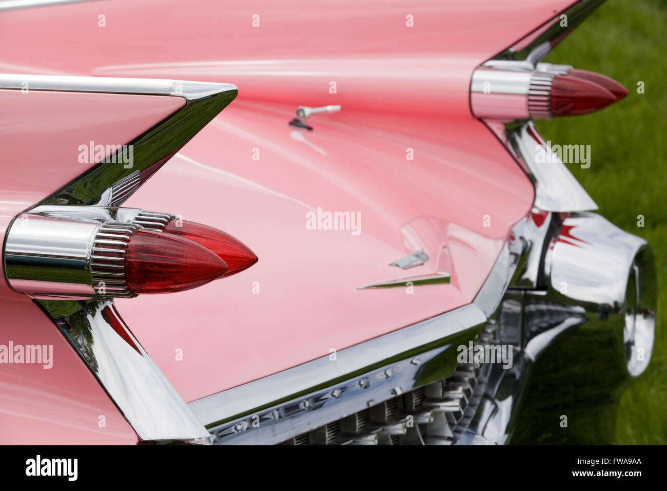 1959 Pink Cadillac. Sharp tail fin with dual bullet tail lights Stock ...