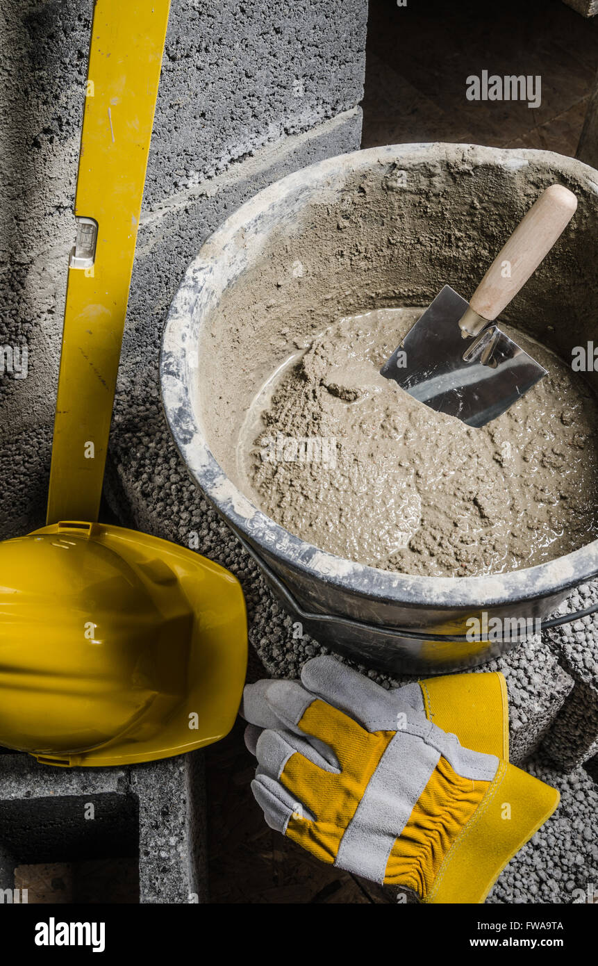 Tools for bricklayer bucket with a solution and a trowel, close-up ...