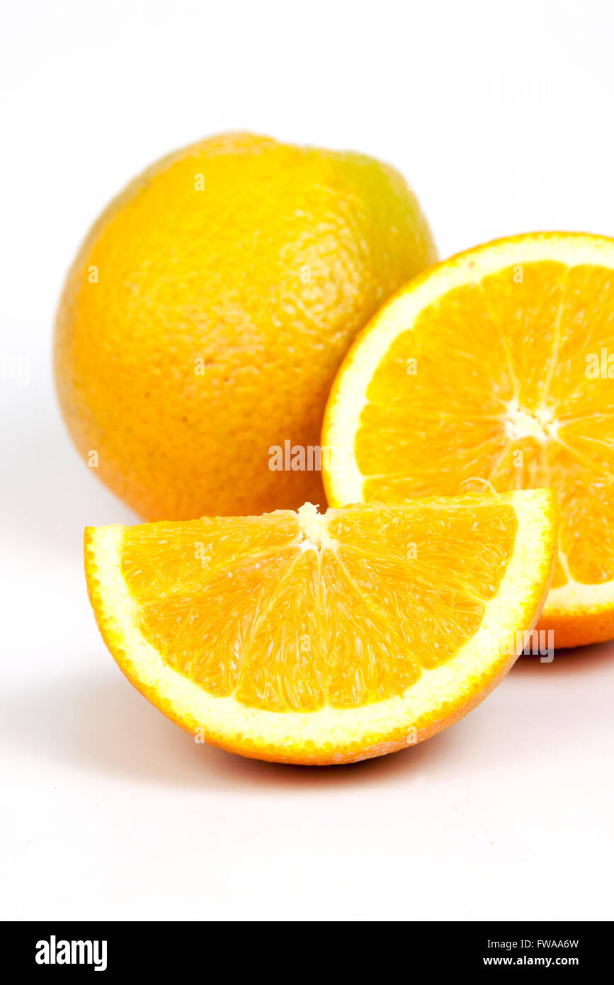 Orange fruit split on white background Stock Photo - Alamy
