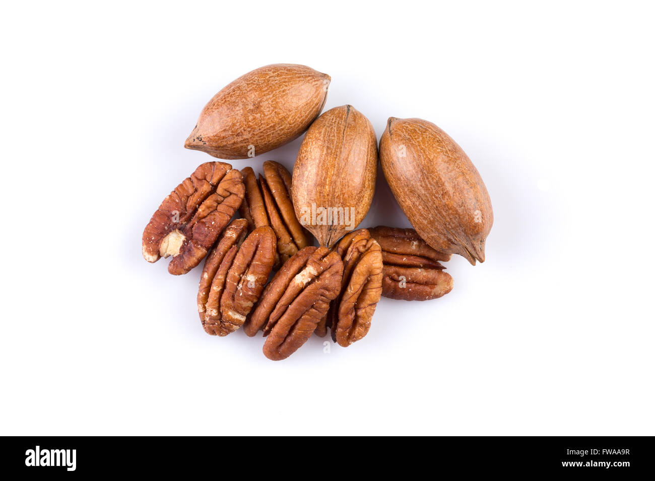 Few pecan nuts isolated on white background Stock Photo - Alamy