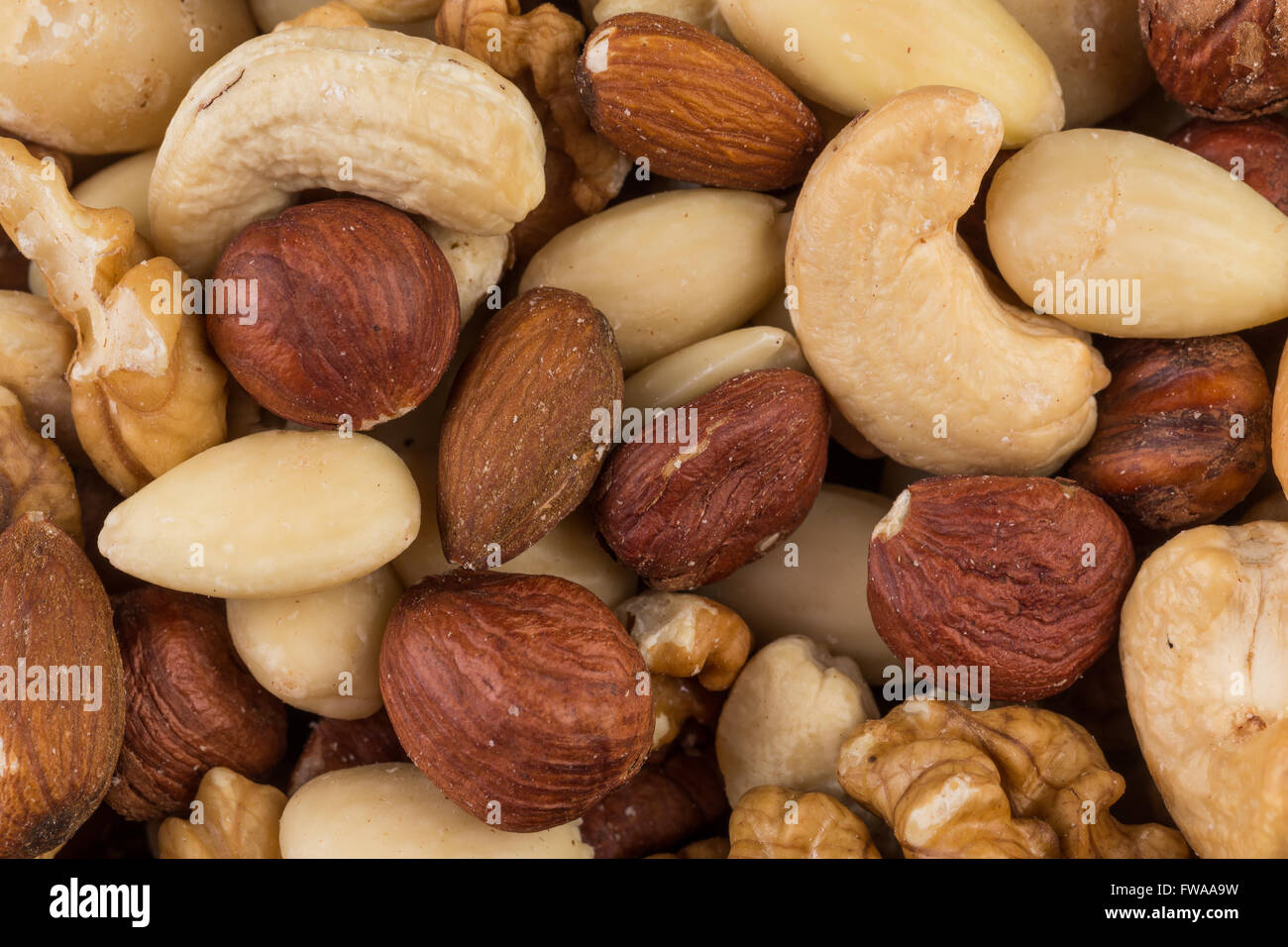 lot of different types of nuts mix for background Stock Photo - Alamy