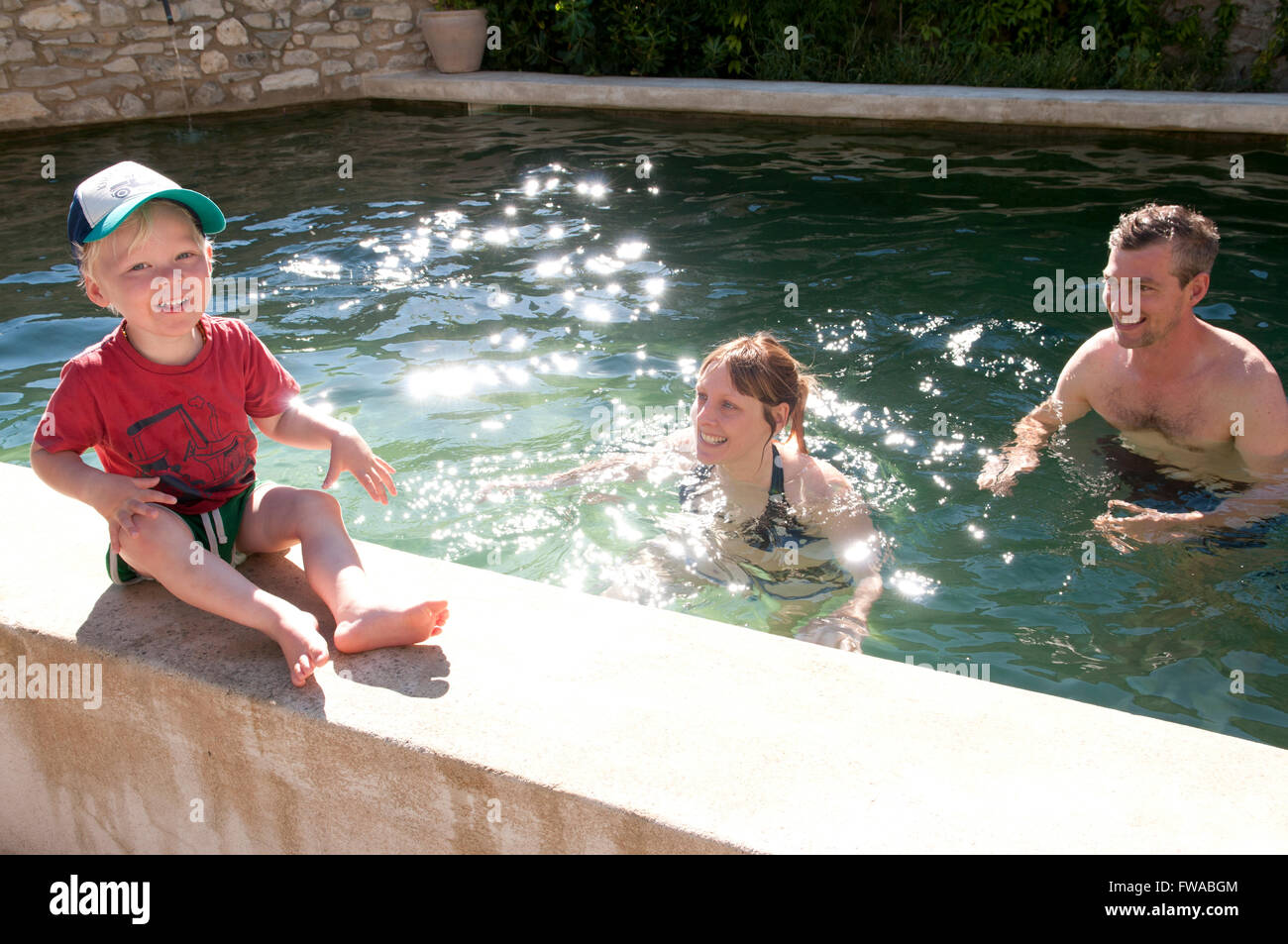 Sitting at a swimming pool hi-res stock photography and images - Alamy