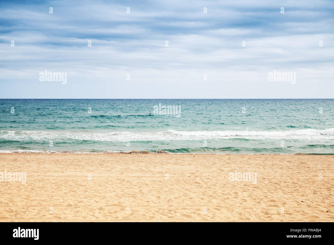 Empty sandy beach. Mediterranean sea coast under cloudy sky, natural ...