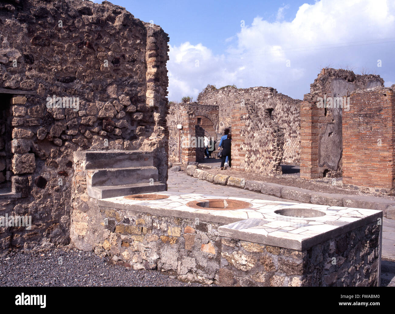 View of a Roman bar counter with built in large drinks containers ...