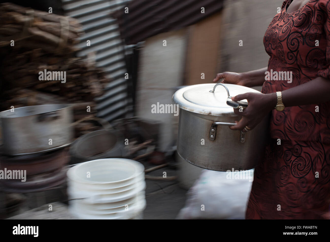 Nigerian woman cooking hi-res stock photography and images - Alamy