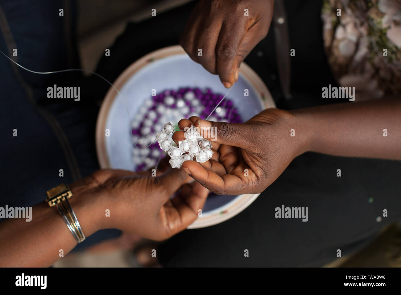 Two women making beaded decorations in Nigeria, Africa Stock Photo - Alamy