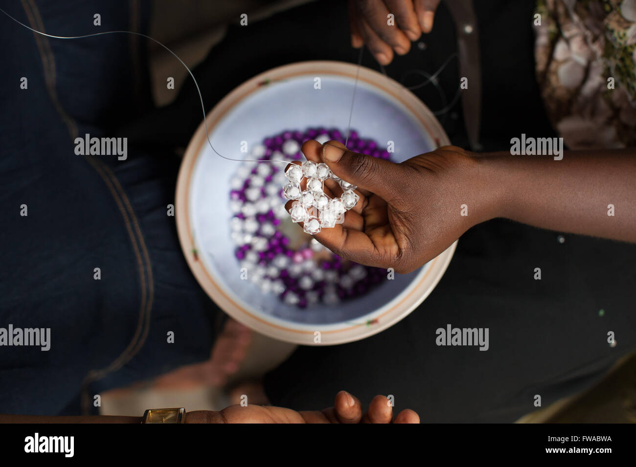 Two women making beaded decorations in Nigeria, Africa Stock Photo - Alamy