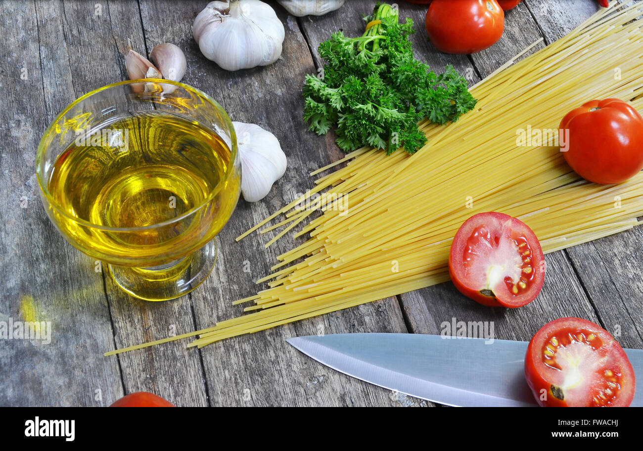 raw spaghetti with ingredients tabletop Stock Photo - Alamy