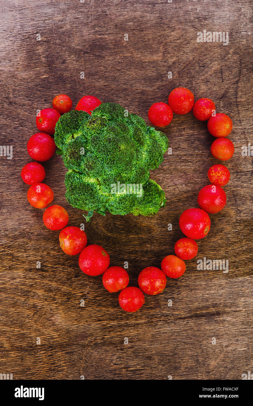 broccoli like a tree standing on a wooden texture on a white background ...