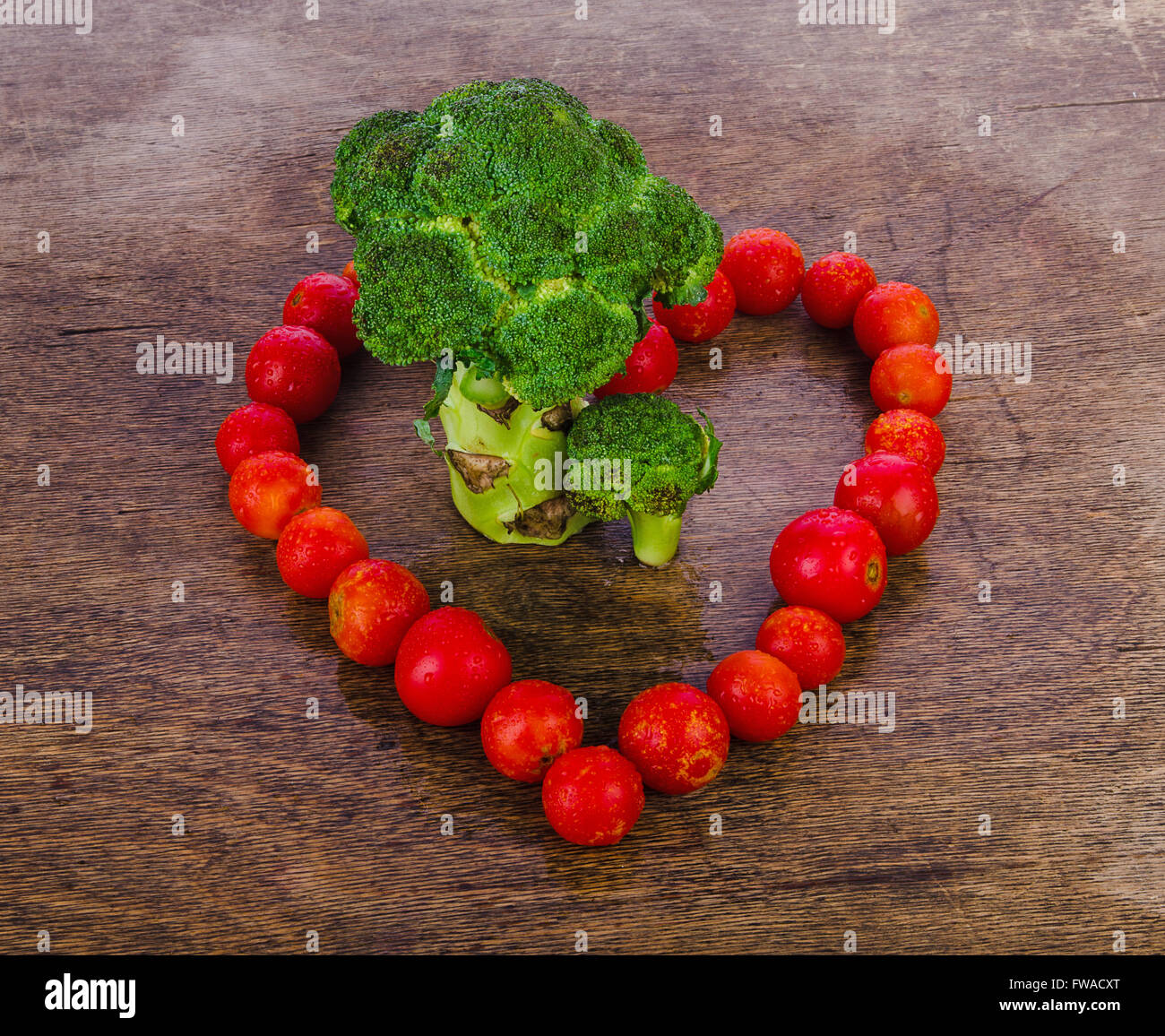 broccoli like a tree standing on a wooden texture on a white background ...