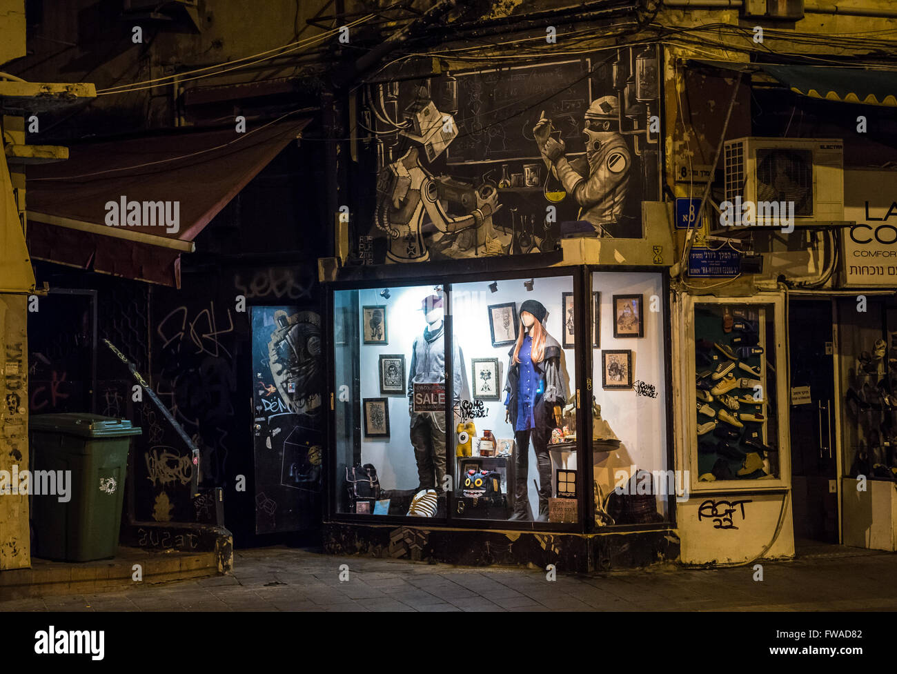 clothes shop with graffiti above shop window in Tel Aviv city, Israel ...