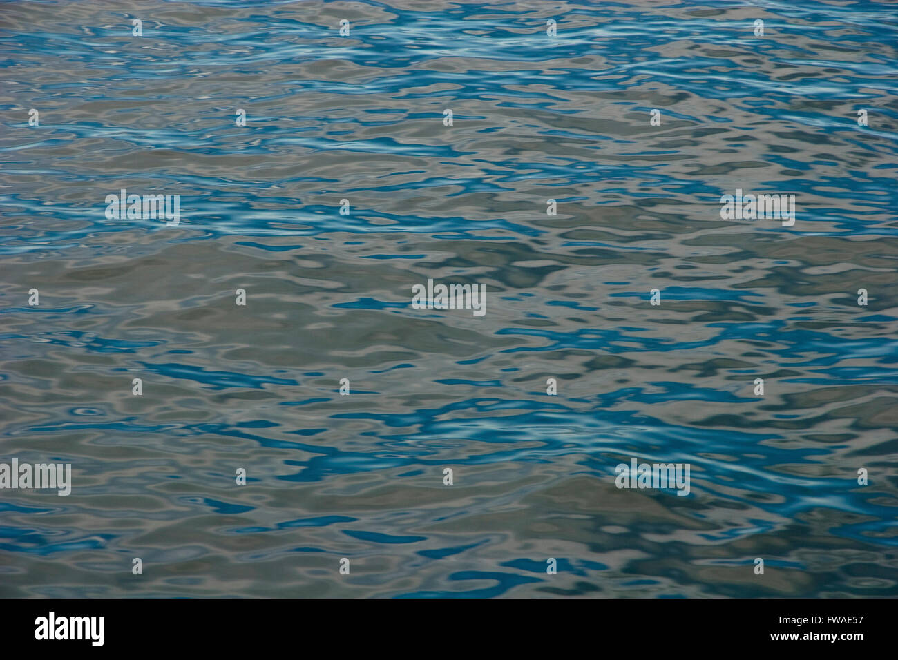 Ocean Ripples with Sky Reflections Stock Photo - Alamy