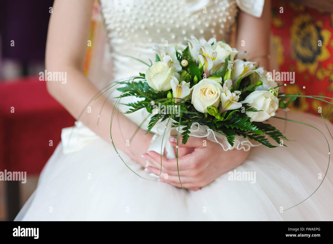 Bride holding bridal bouquet close up. white roses Stock Photo - Alamy