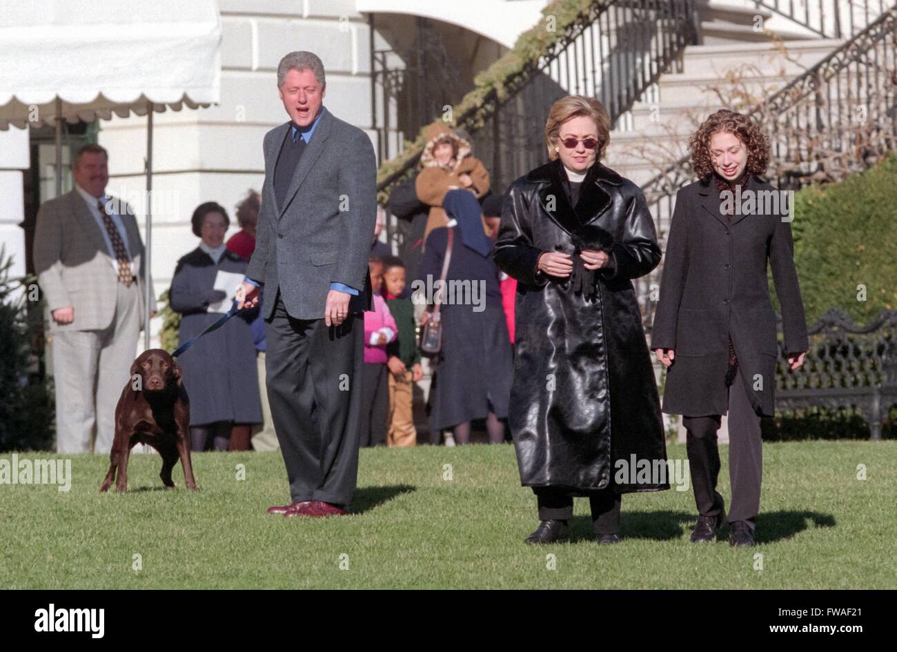 U.S. President Bill Clinton walks from the White House with First Lady ...