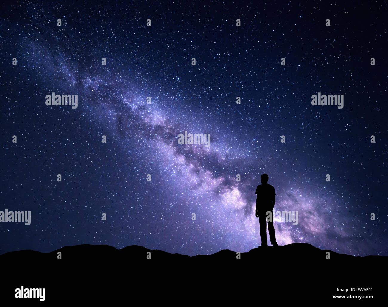 Landscape with purple Milky Way. Night sky with stars and silhouette of ...