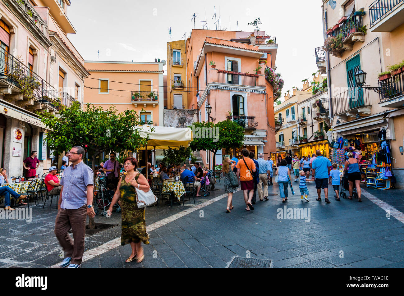 The lively streets of Taormina in summer sundown. Taormina, Messina ...