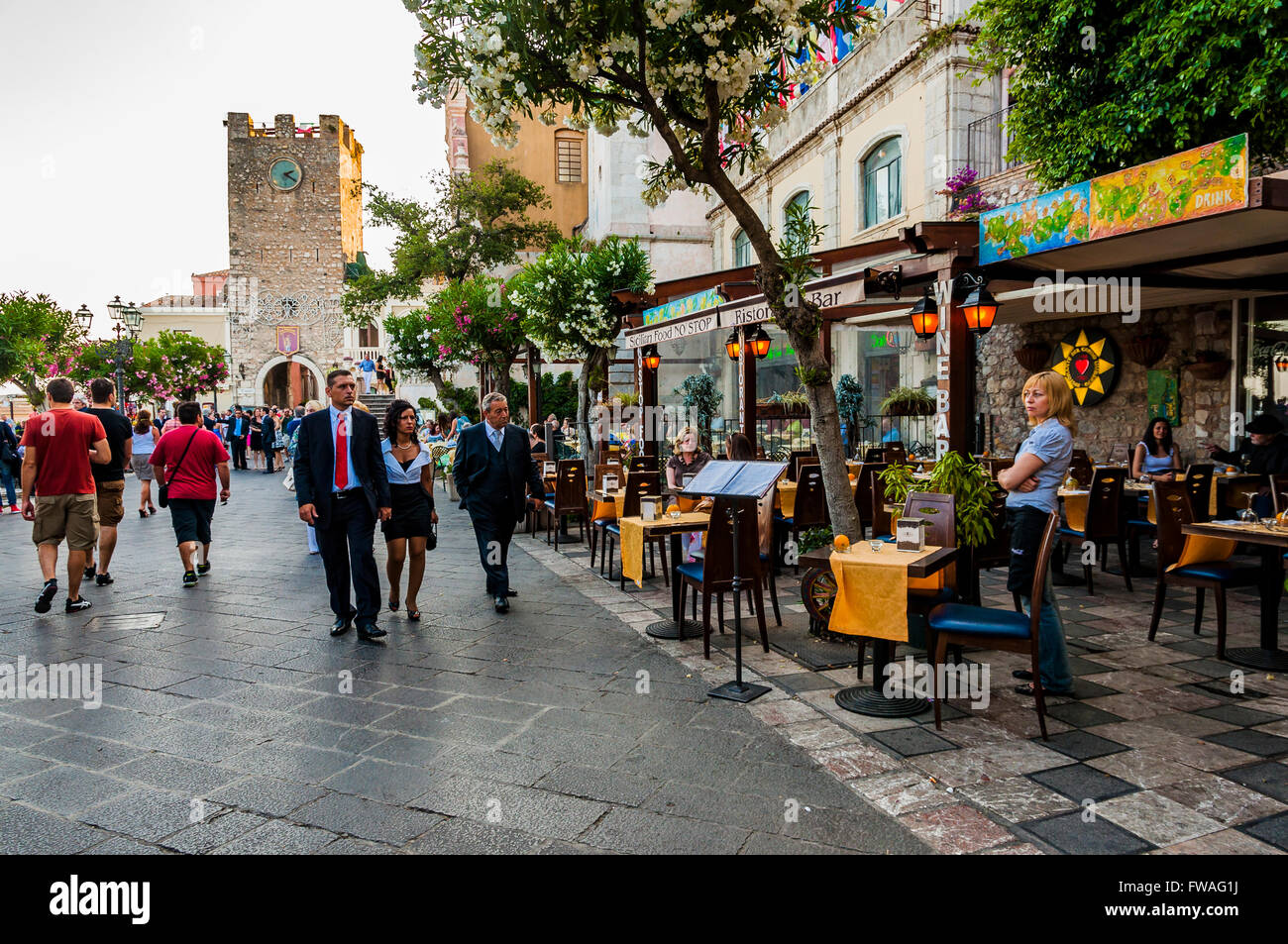 The lively streets of Taormina in summer sundown. Taormina, Messina ...