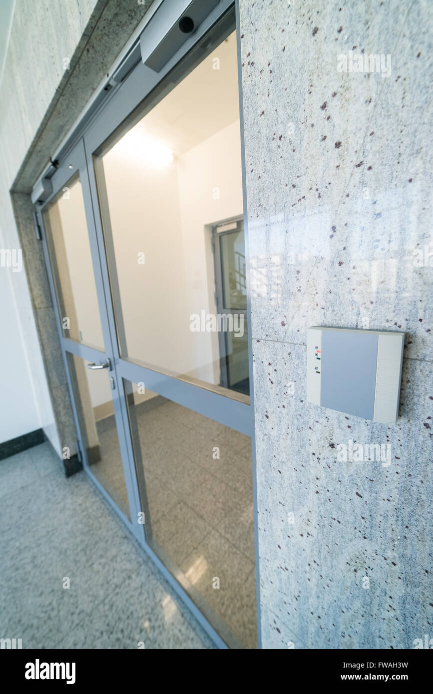 the massive, gray door and the access control system Stock Photo - Alamy