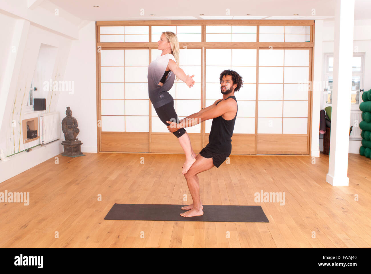 Acro Yoga teaching through demonstration Stock Photo - Alamy