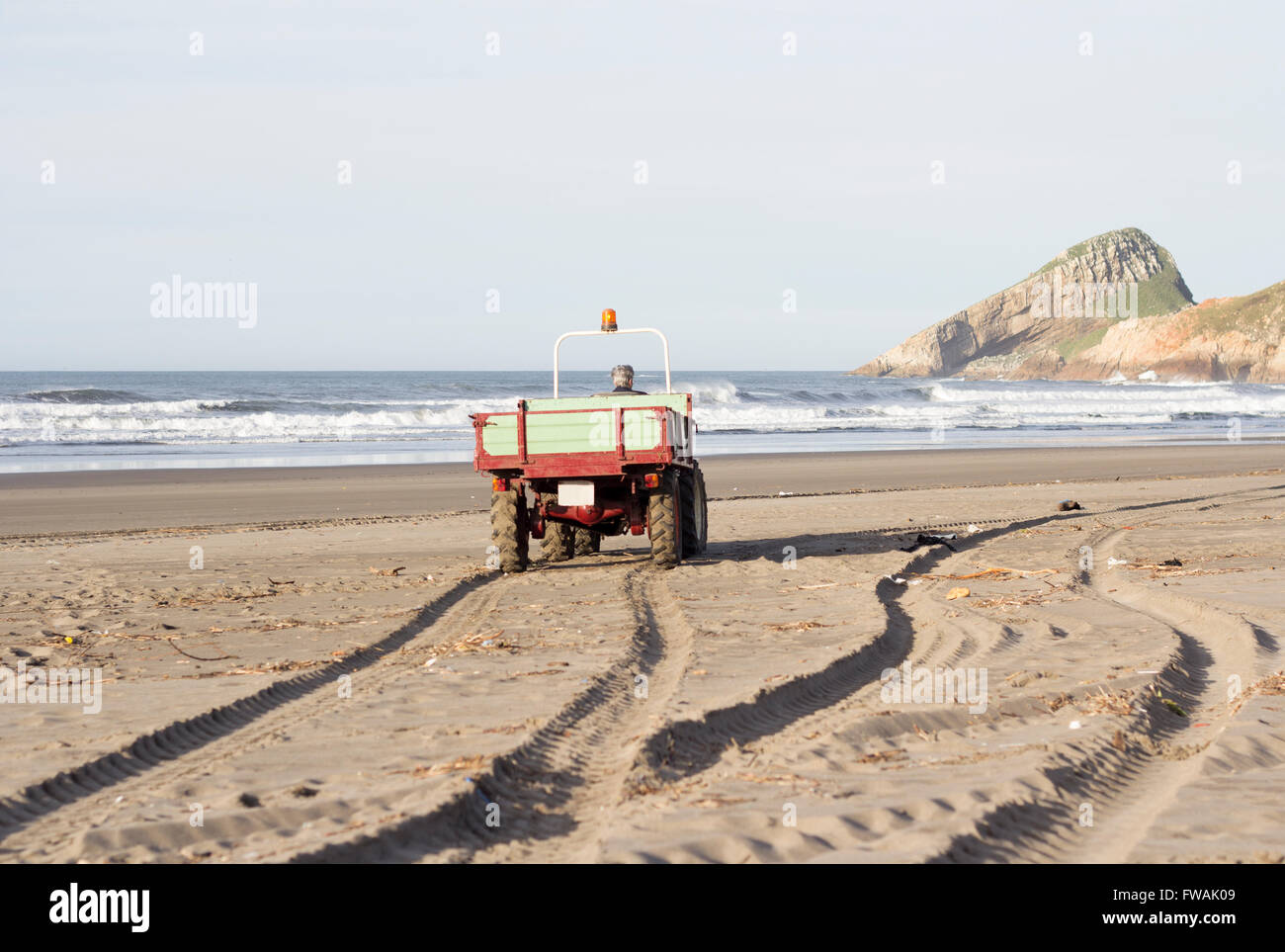 Rear view of a tractor at beach Stock Photo - Alamy